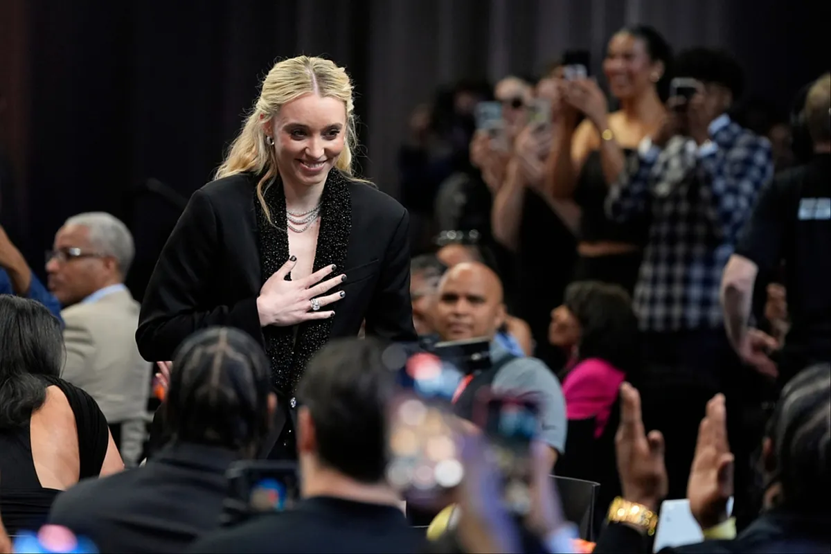 Paige Panic: Bueckers clutches jacket mid-draft to dodge wardrobe ...